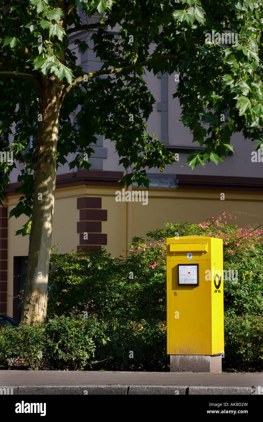 yellow post box of the German Post, Germany Stock Photo - Alamy