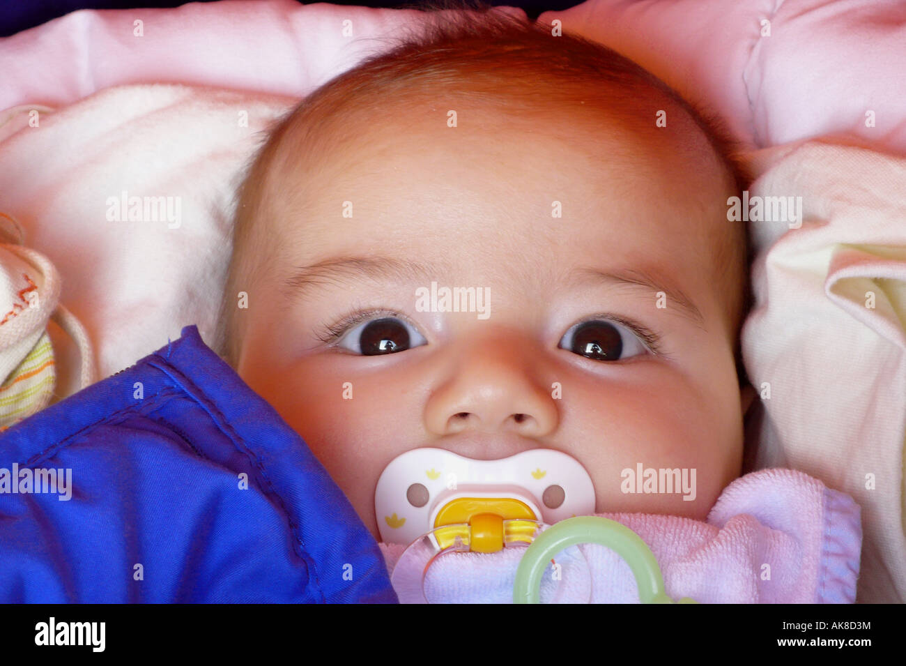 face of a baby with comforter Stock Photo - Alamy