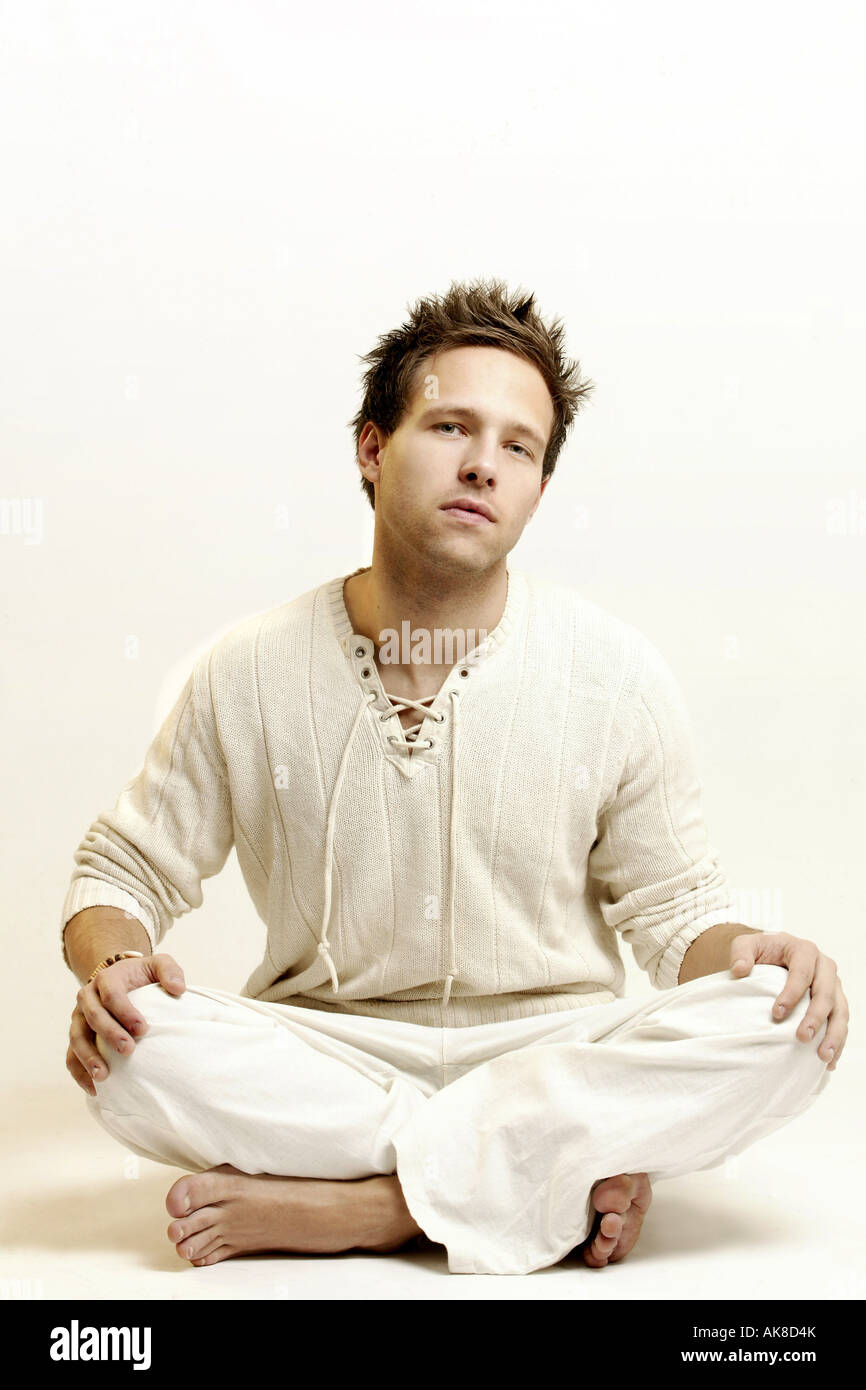 young man cross legged Stock Photo - Alamy