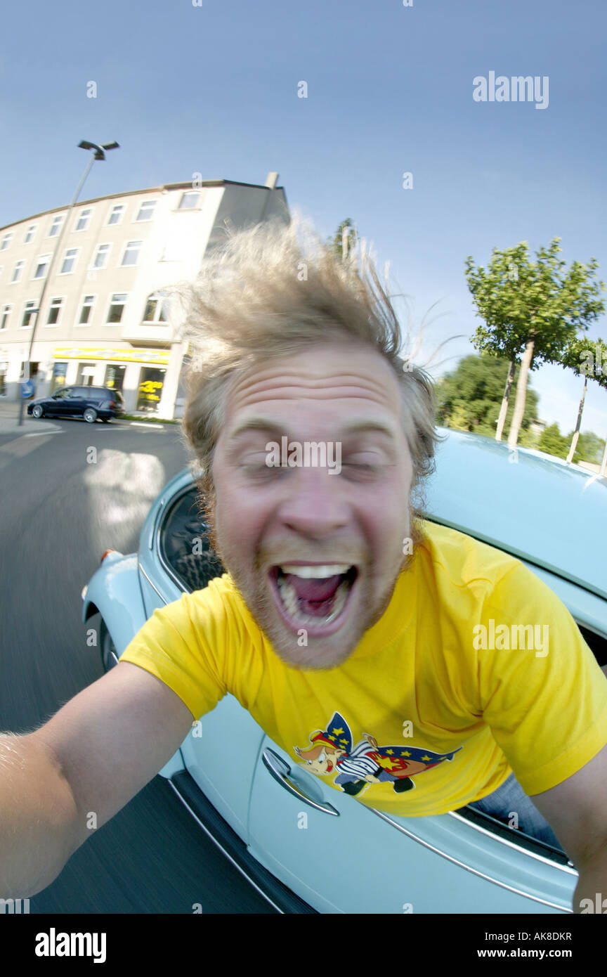 young man making a picture of himself in a driving car, Germany, Ruhr ...