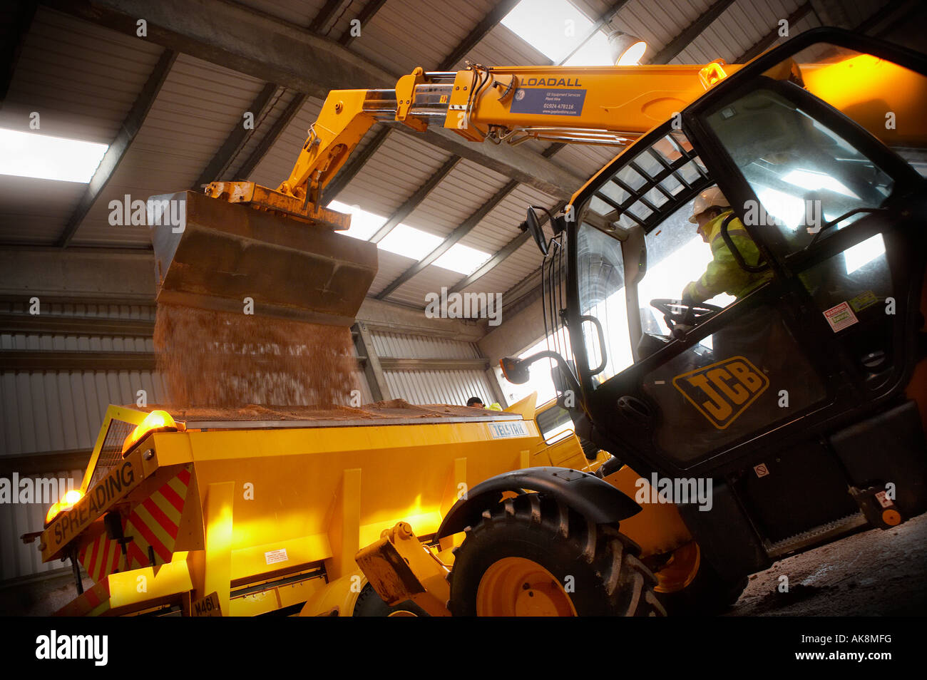 HIGHWAYS AGENCY GRITTING SNOW PLOUGH TRUCK LOADING WITH GRIT SAND AND ...