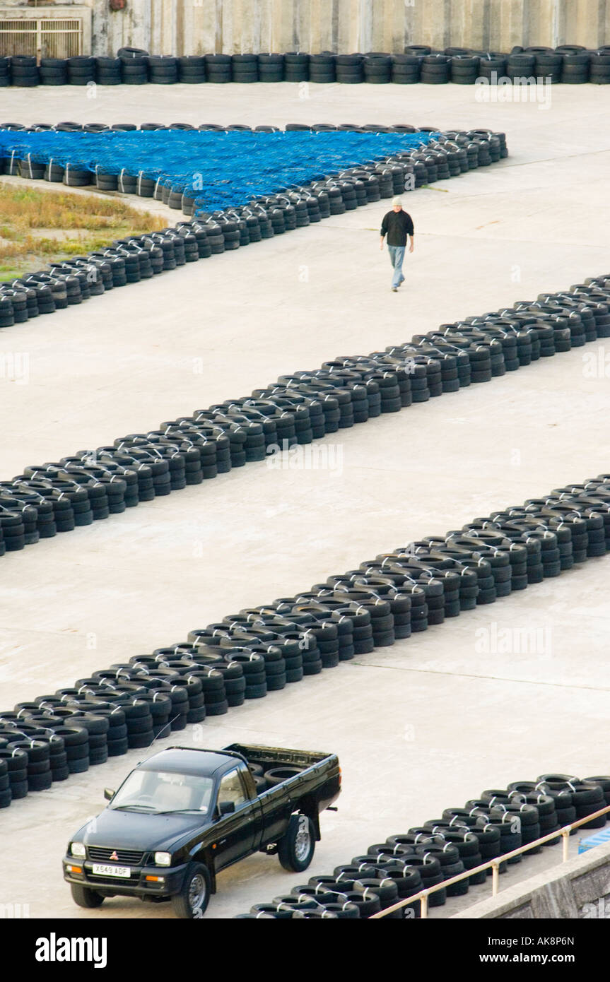 Man walking down empty Go Kart track Stock Photo - Alamy