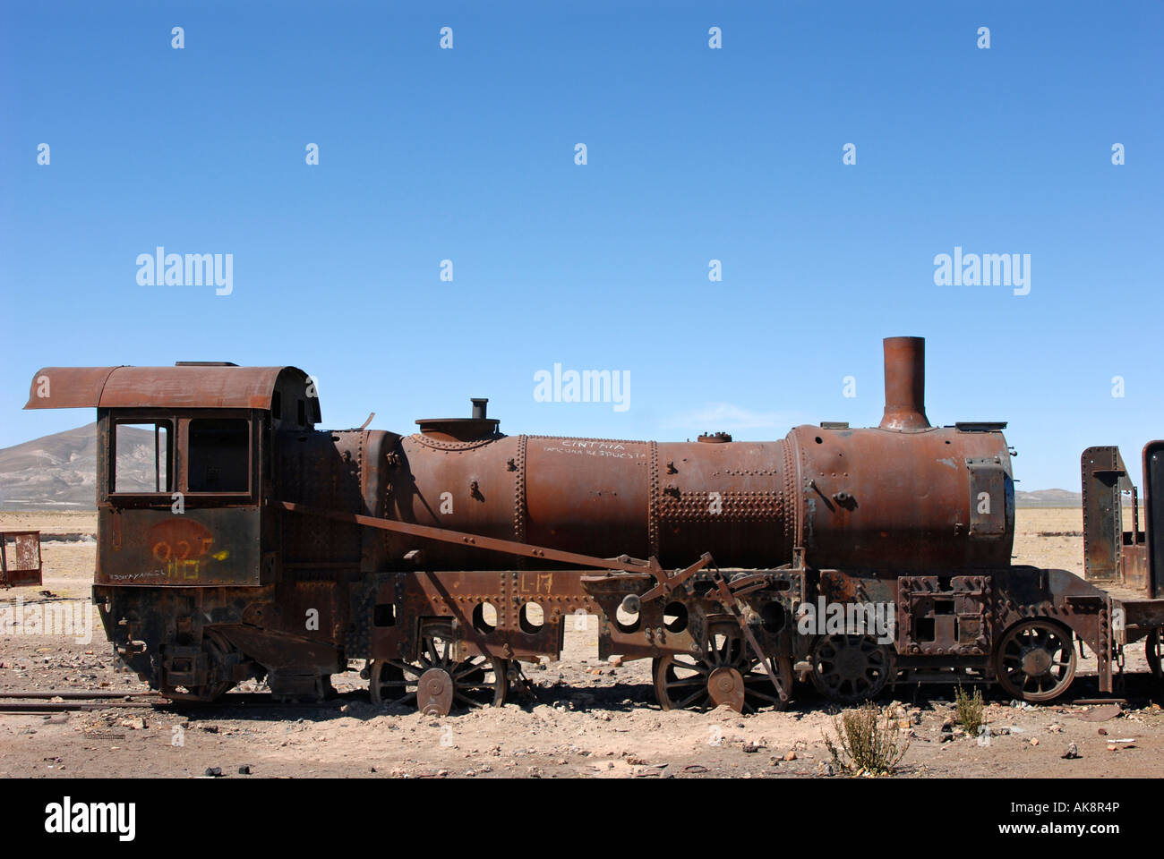 An old, rusty train sits in a train graveyard outside of Uyuni, Bolivia ...