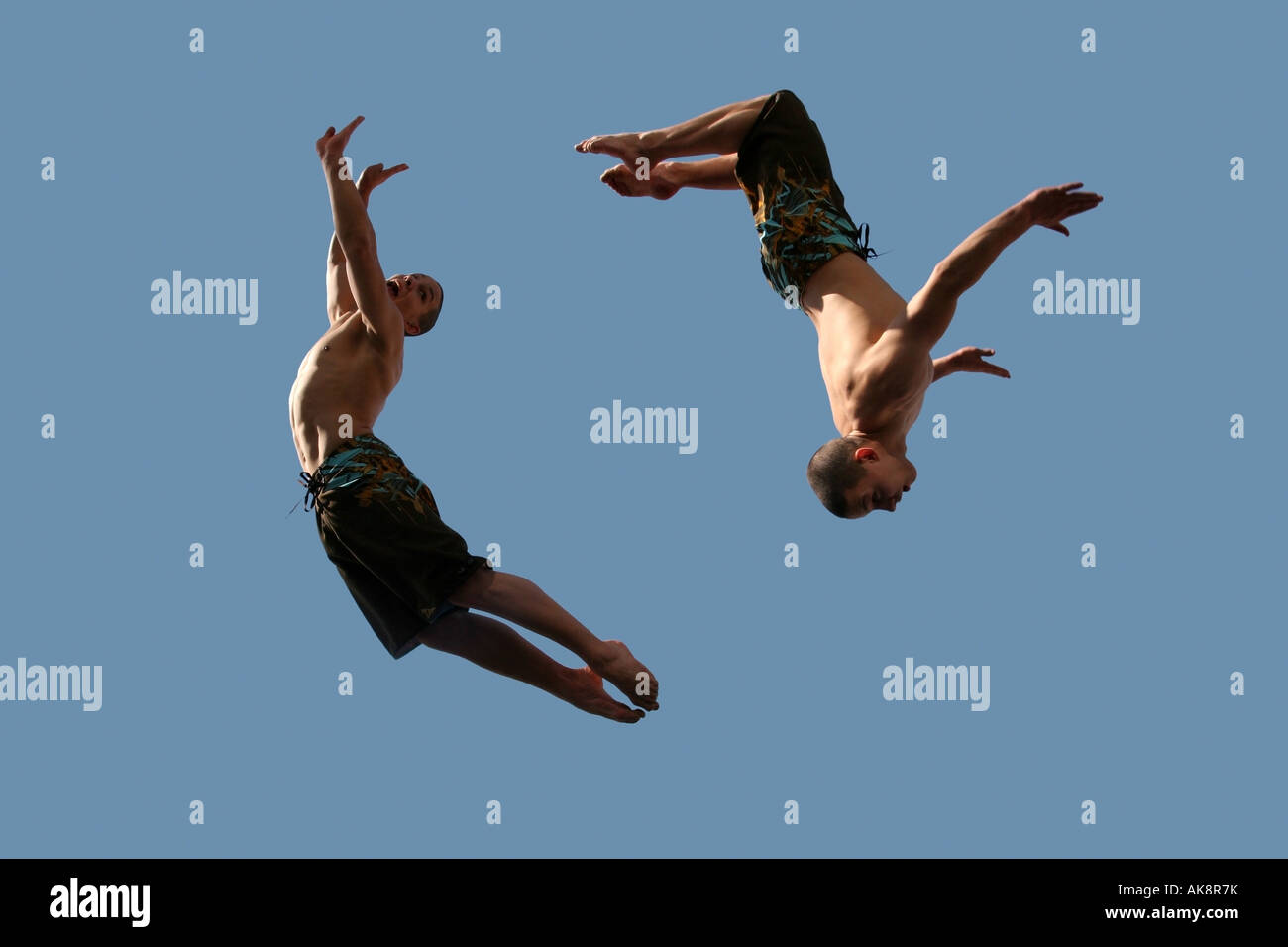 An image of two flying young athletic men Stock Photo - Alamy