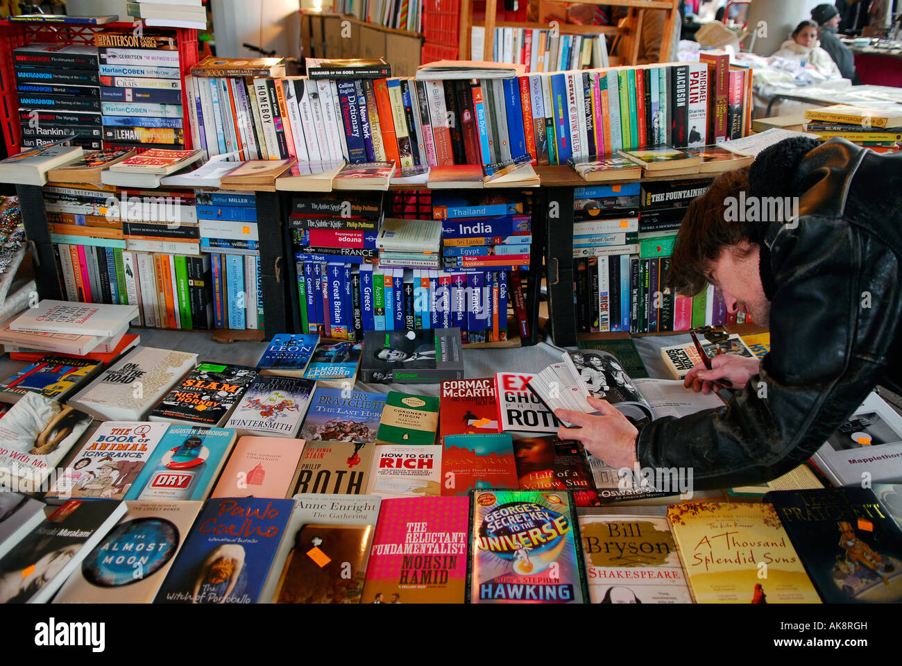 Man perusing book stall at Portobello Market Westminster London UK ...