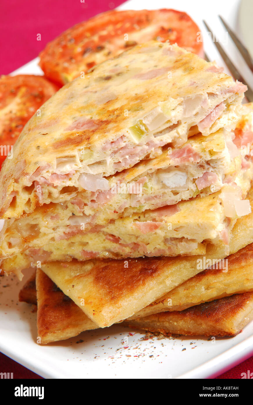 Breakfast of cheese and bacon omelette slices on Irish farls (potato ...