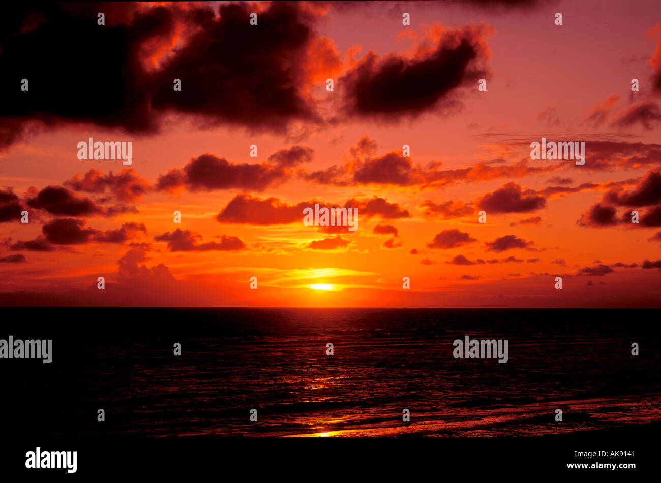 sunset over sea Stock Photo - Alamy
