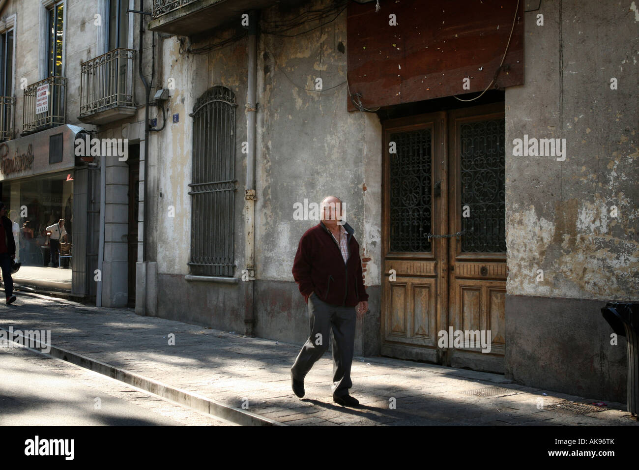 french man walking down the street pyrenees Stock Photo - Alamy
