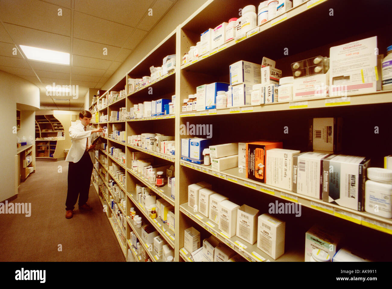 Stocking Pharmacy Shelves Stock Photo - Alamy