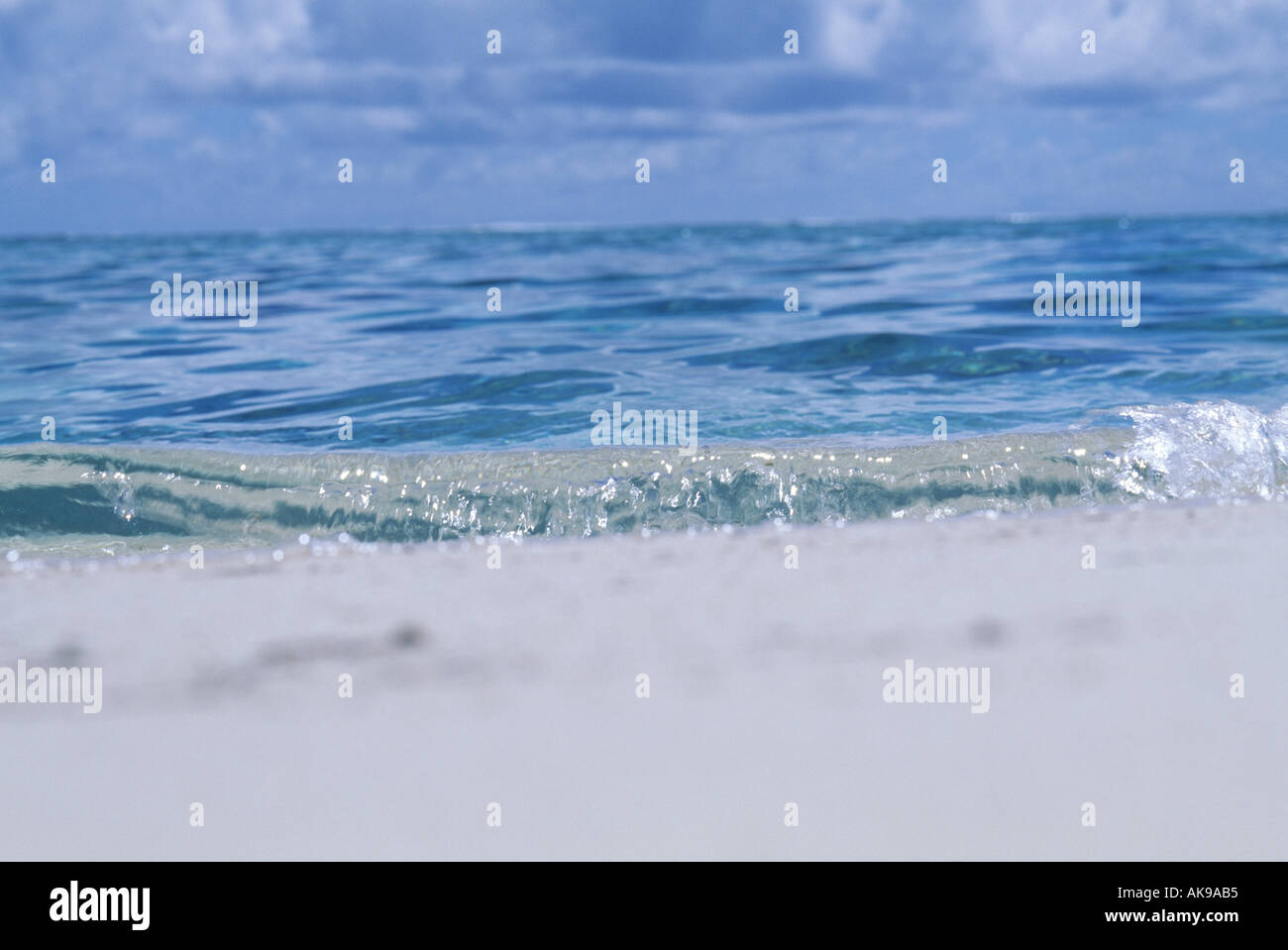 Wave on the beach Stock Photo - Alamy