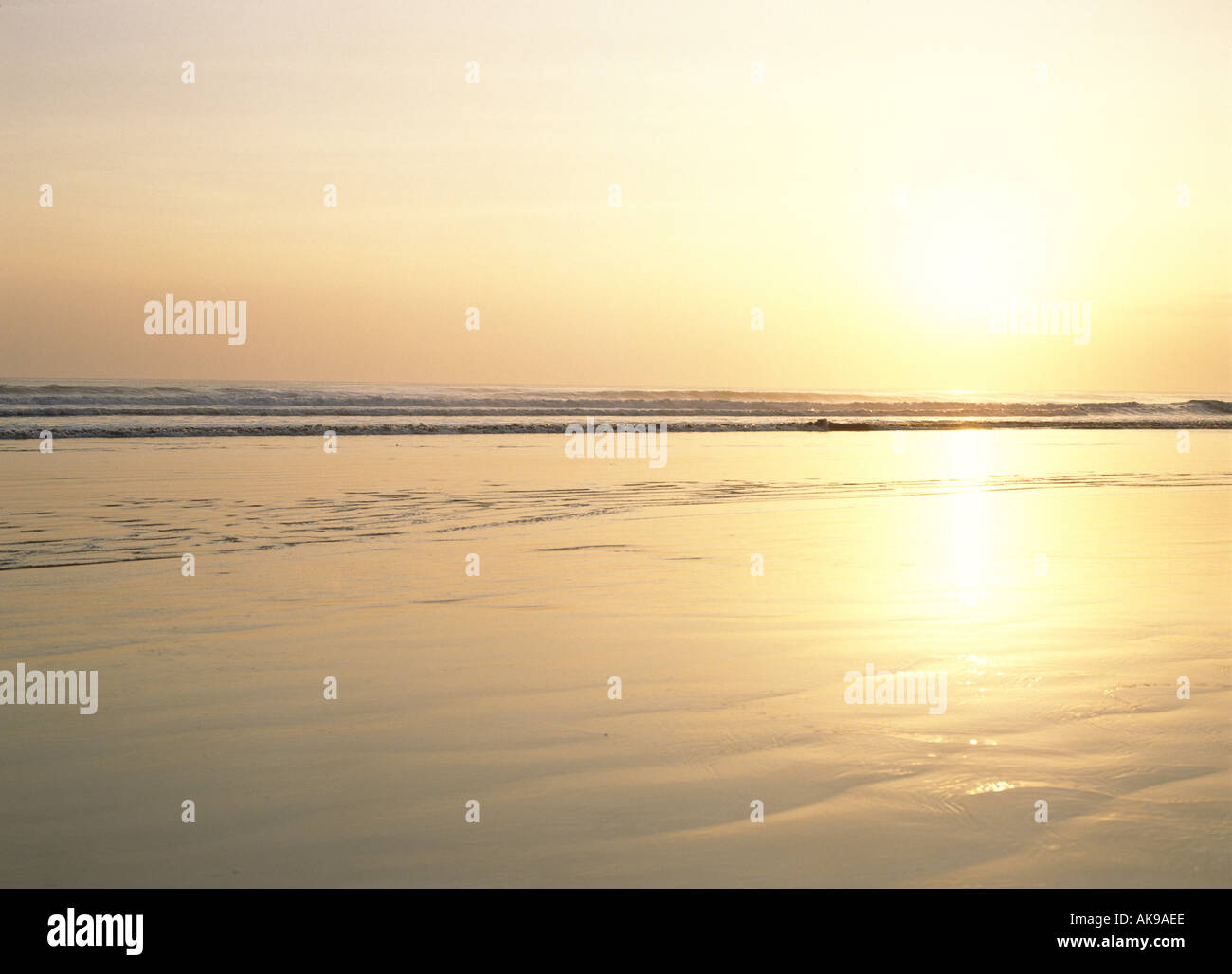 Sunset on the beach Stock Photo - Alamy