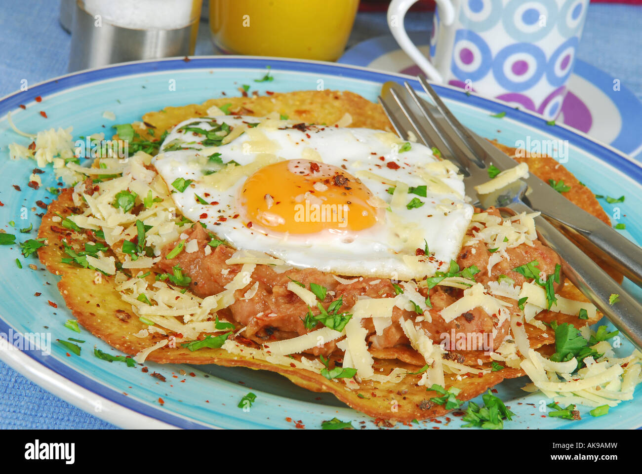 A Mexican-style breakfast of huevos rancheros: a fried corn tortilla ...
