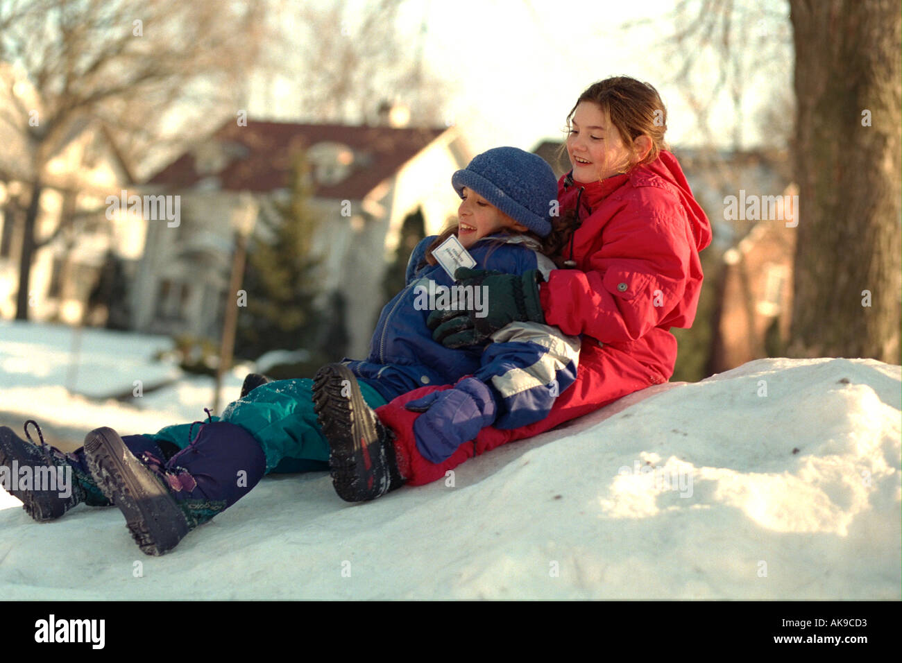 Kids age 10 sliding down snow bank at Winter Carnival Snow Sculpting ...