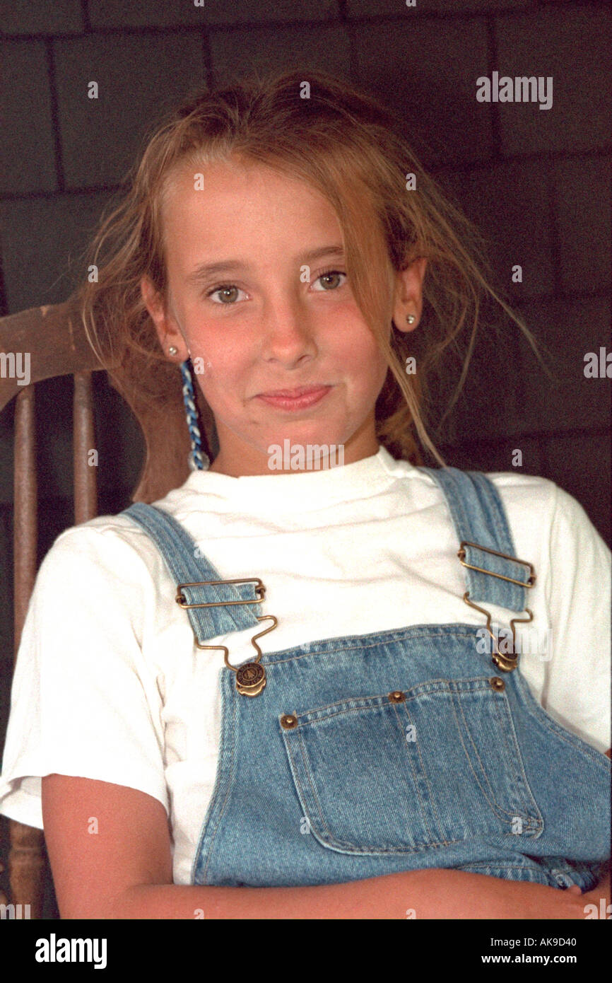Girl age 11 waiting for grilled barbecue dinner on summer holiday ...