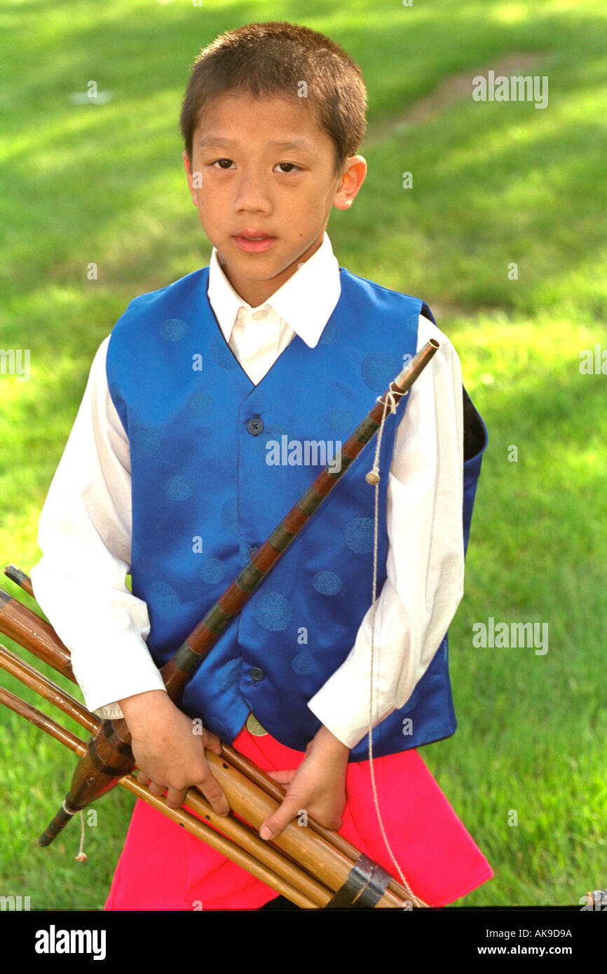 Hmong musician age 12 holding traditional Hmong musical instrument at ...