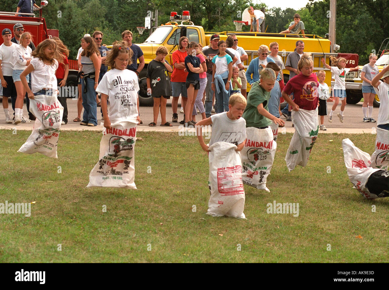Kids age 11 in potato sack race in Watermelon Days Festival. Vining ...