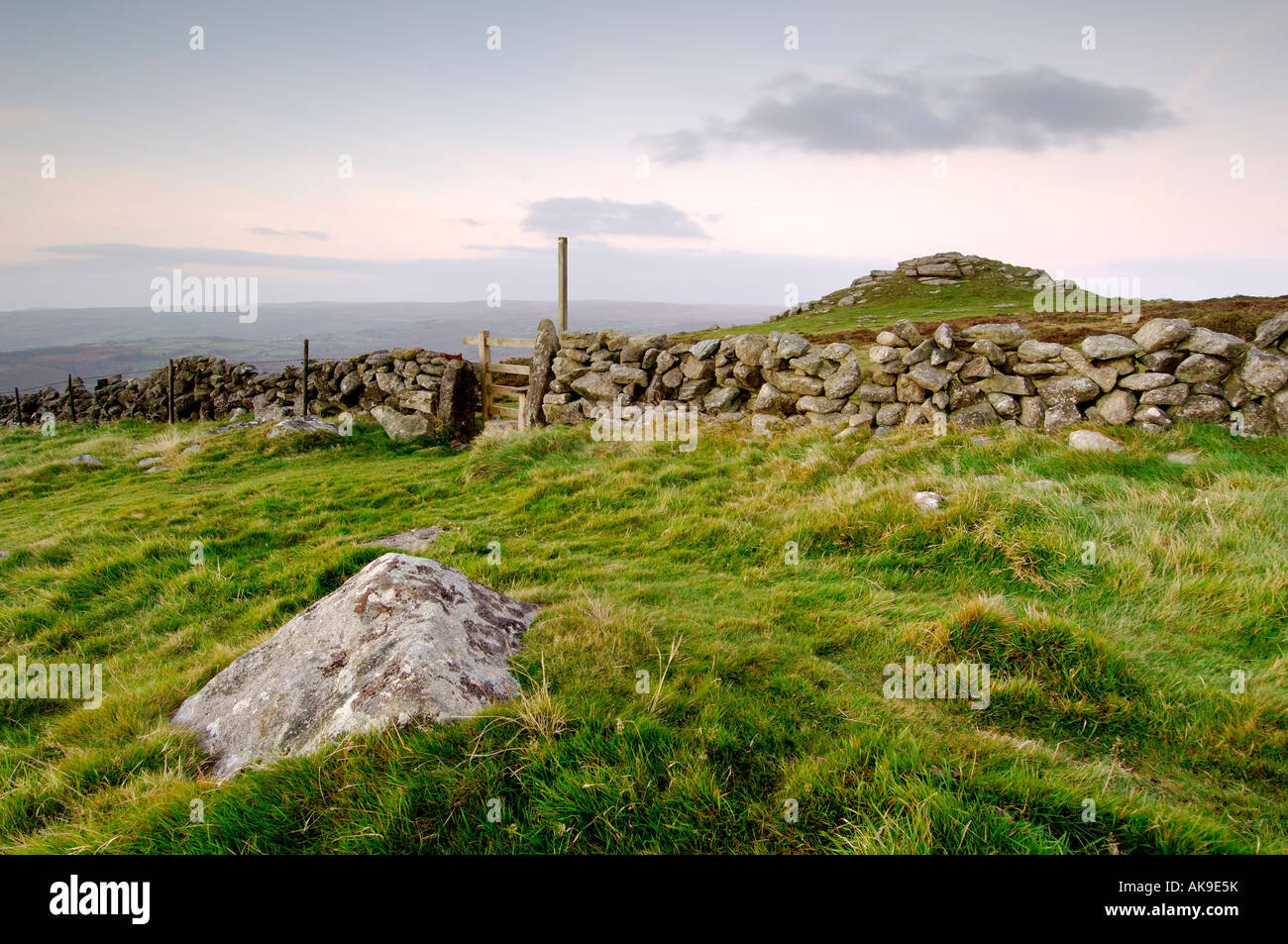 Just before dawn at Buckland Beacon on Dartmoor with a dry stone wall ...