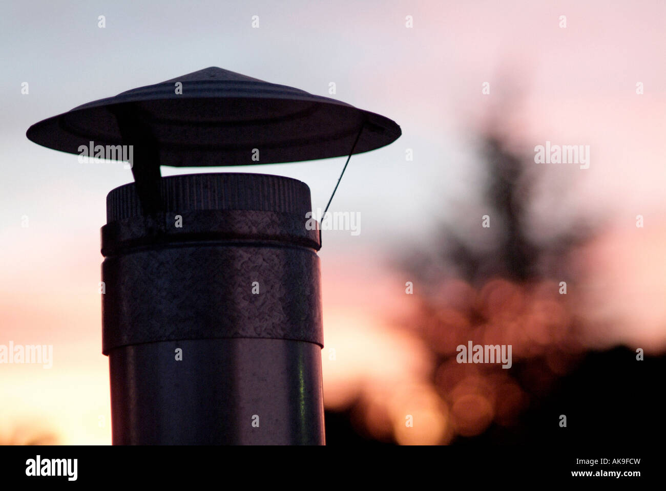Detail of a chimney at sunset Stock Photo - Alamy