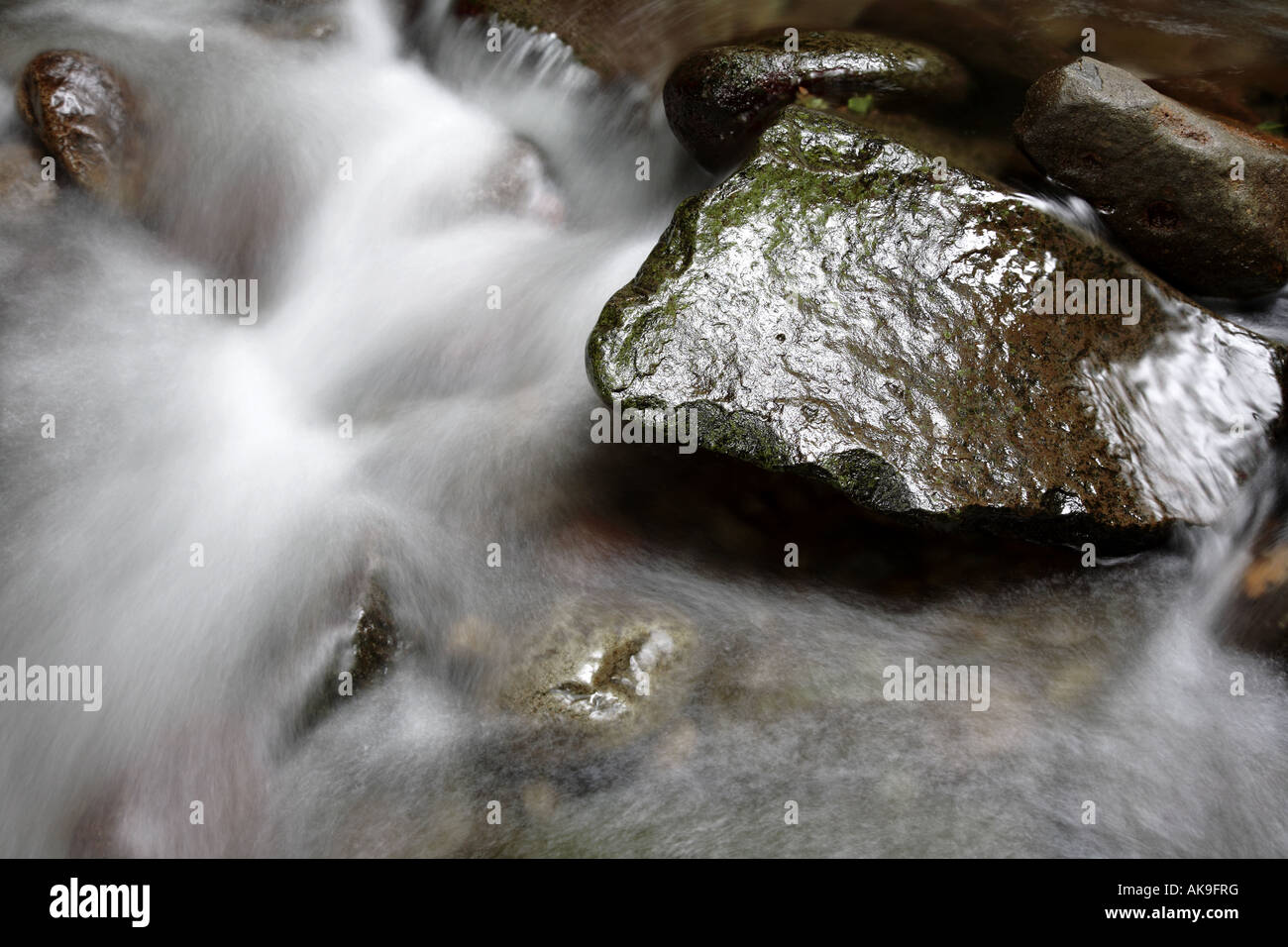 Stream and rocks Stock Photo - Alamy