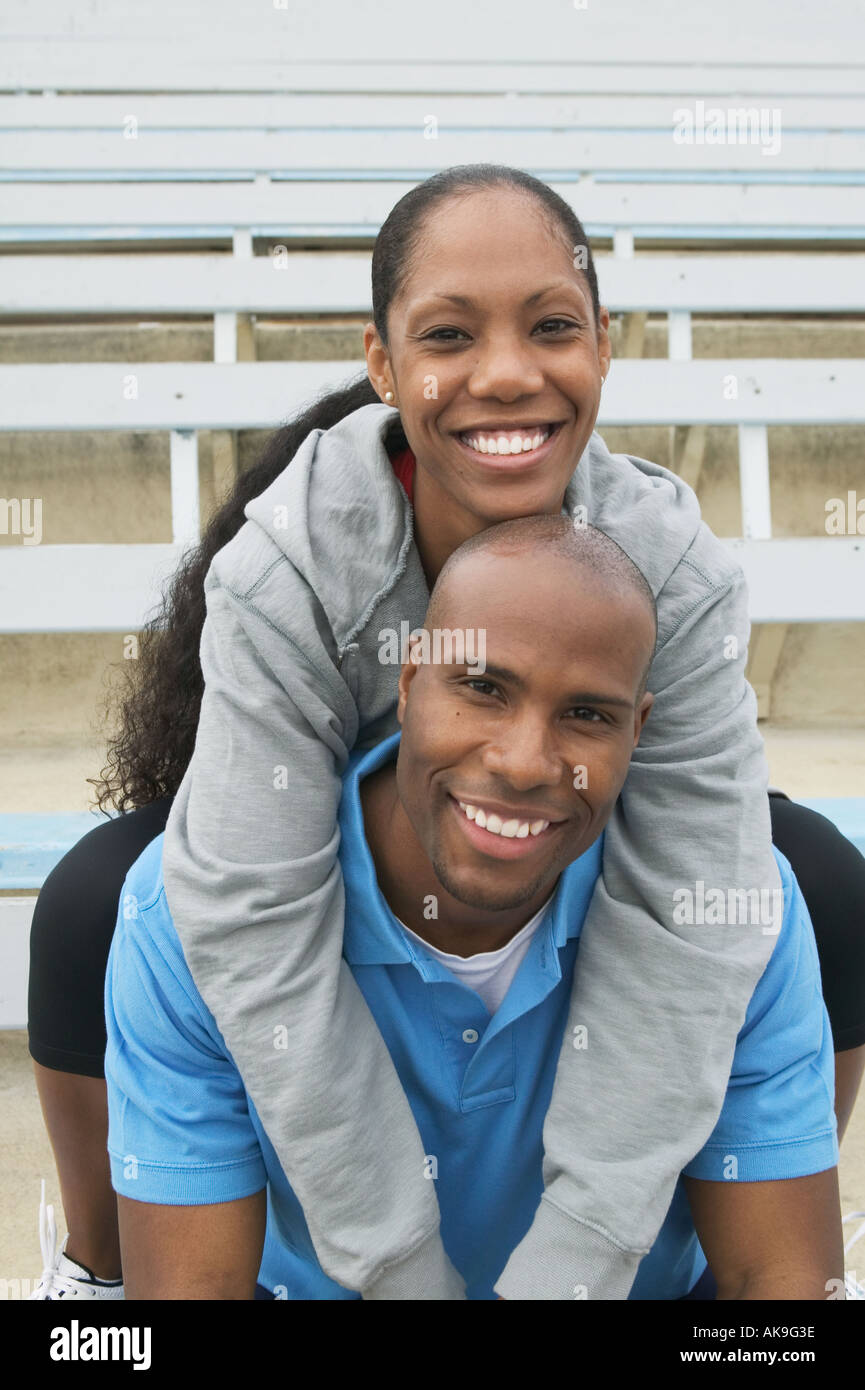 Portrait of couple hugging Stock Photo - Alamy