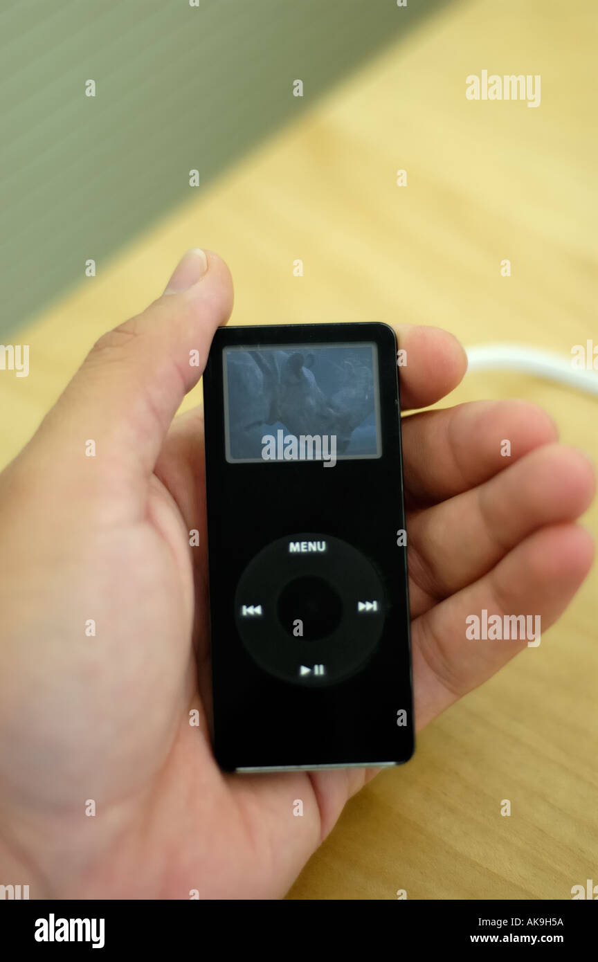 Woman hand holding ipod nano hi-res stock photography and images - Alamy
