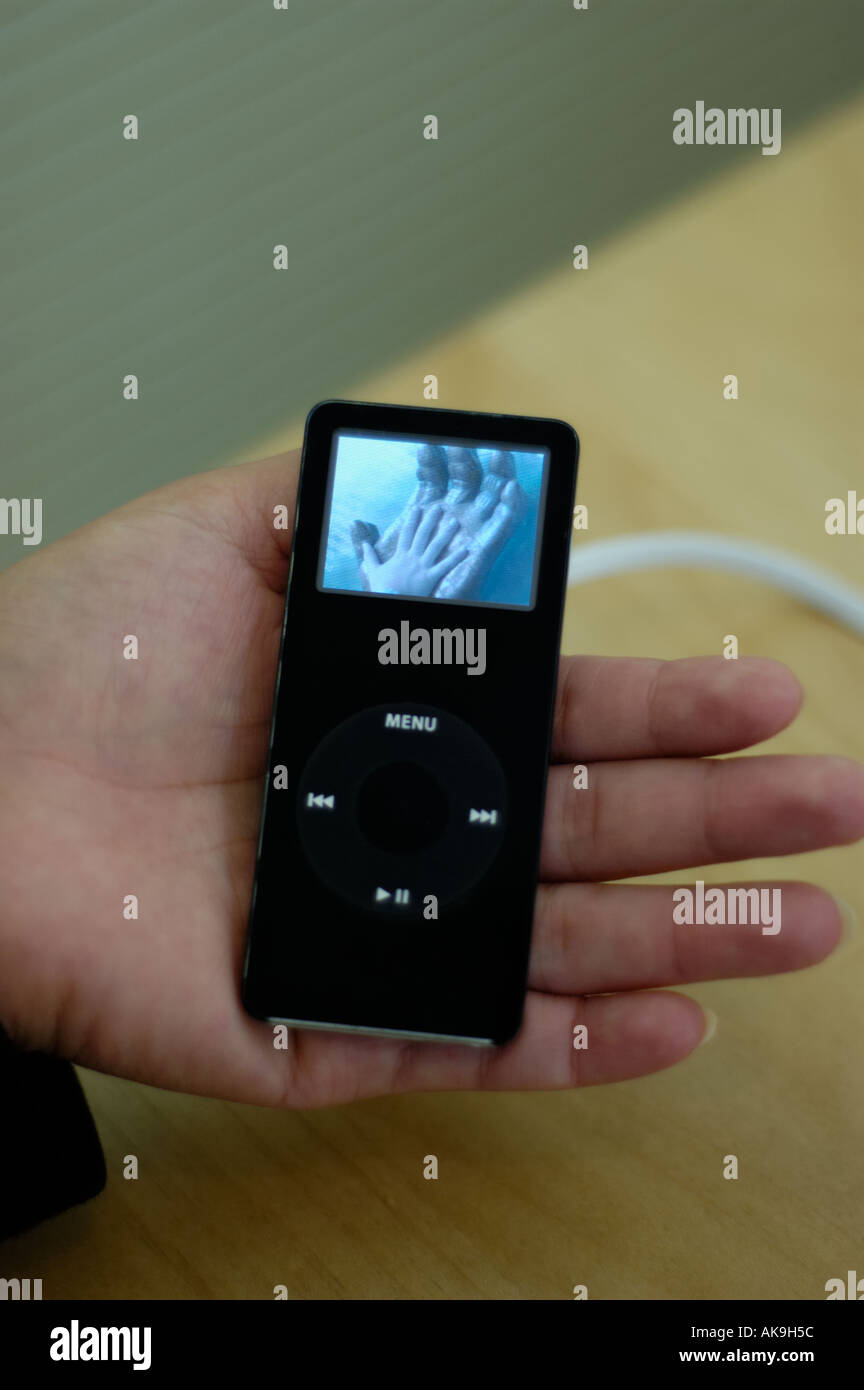 Woman hand holding ipod nano hi-res stock photography and images - Alamy
