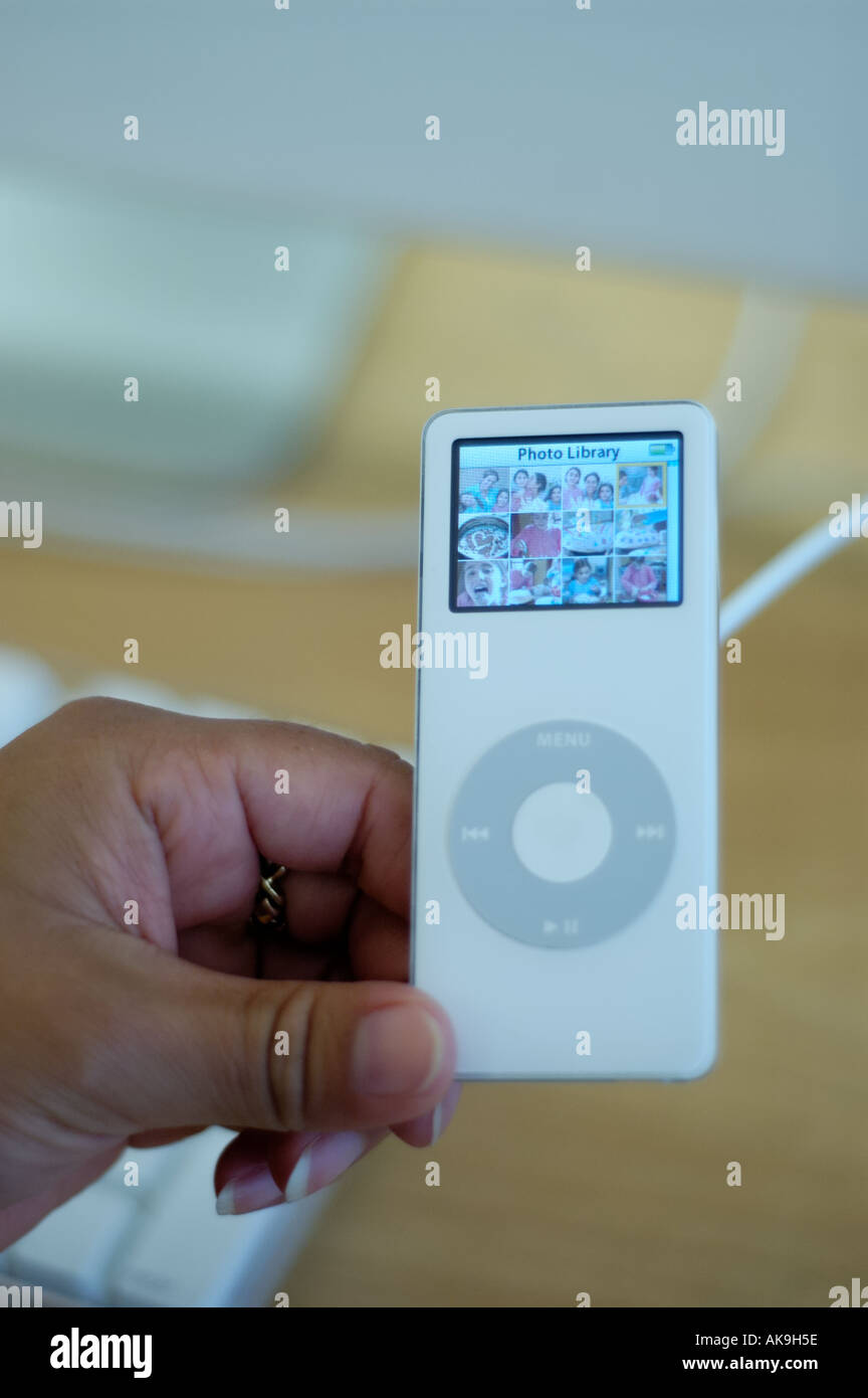 Woman hand holding ipod nano hi-res stock photography and images - Alamy