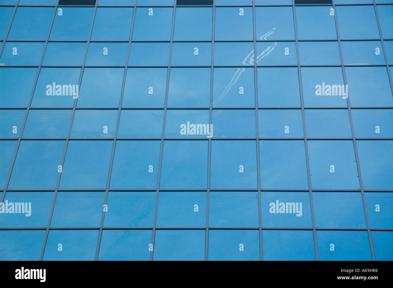 Grid pattern on glass wall of office building Stock Photo - Alamy