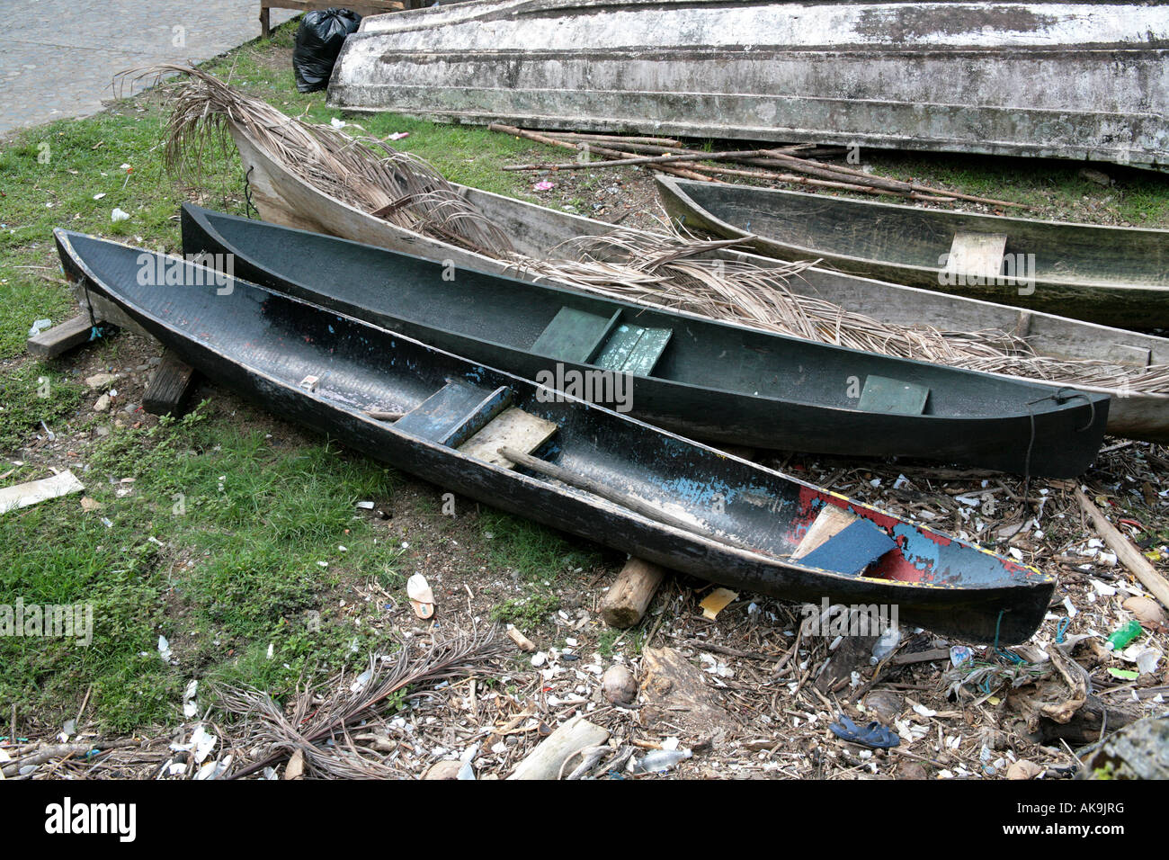 Rustic canoes used by artisan fishermen at the Atlantic coast of Colon ...