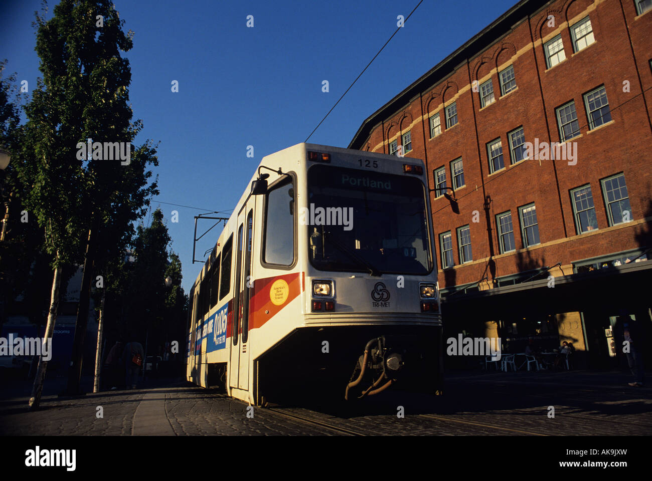 Retro image of Light Rail train at sunrise downtown Oldtown District ...