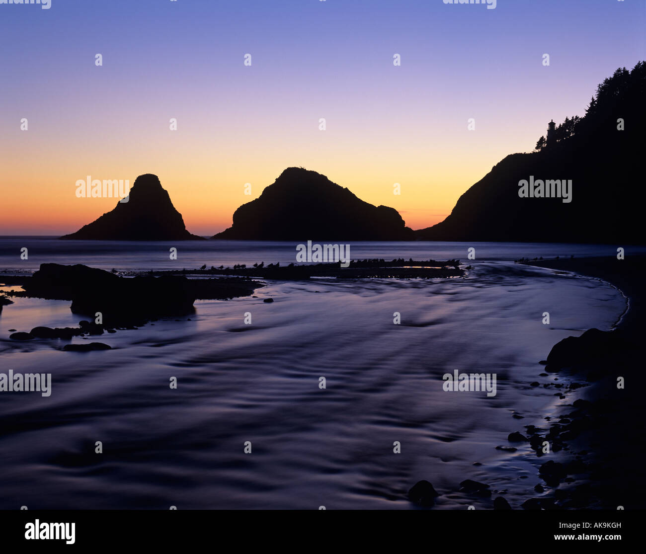 Heceta Head lighthouse at Devils Elbow State Park sunset along river ...
