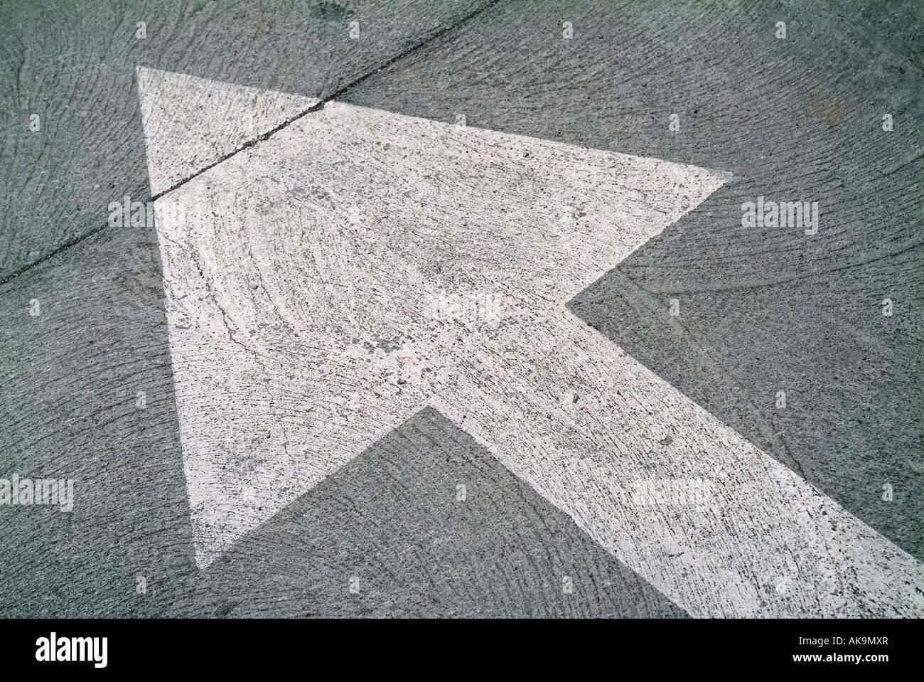 Direction traffic sign painted on the pavement Stock Photo - Alamy