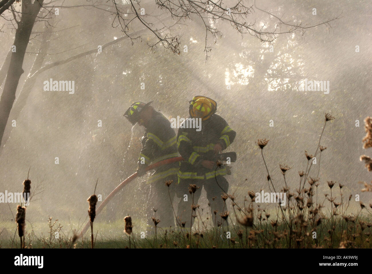 Water being sprayed on fire hi-res stock photography and images - Alamy
