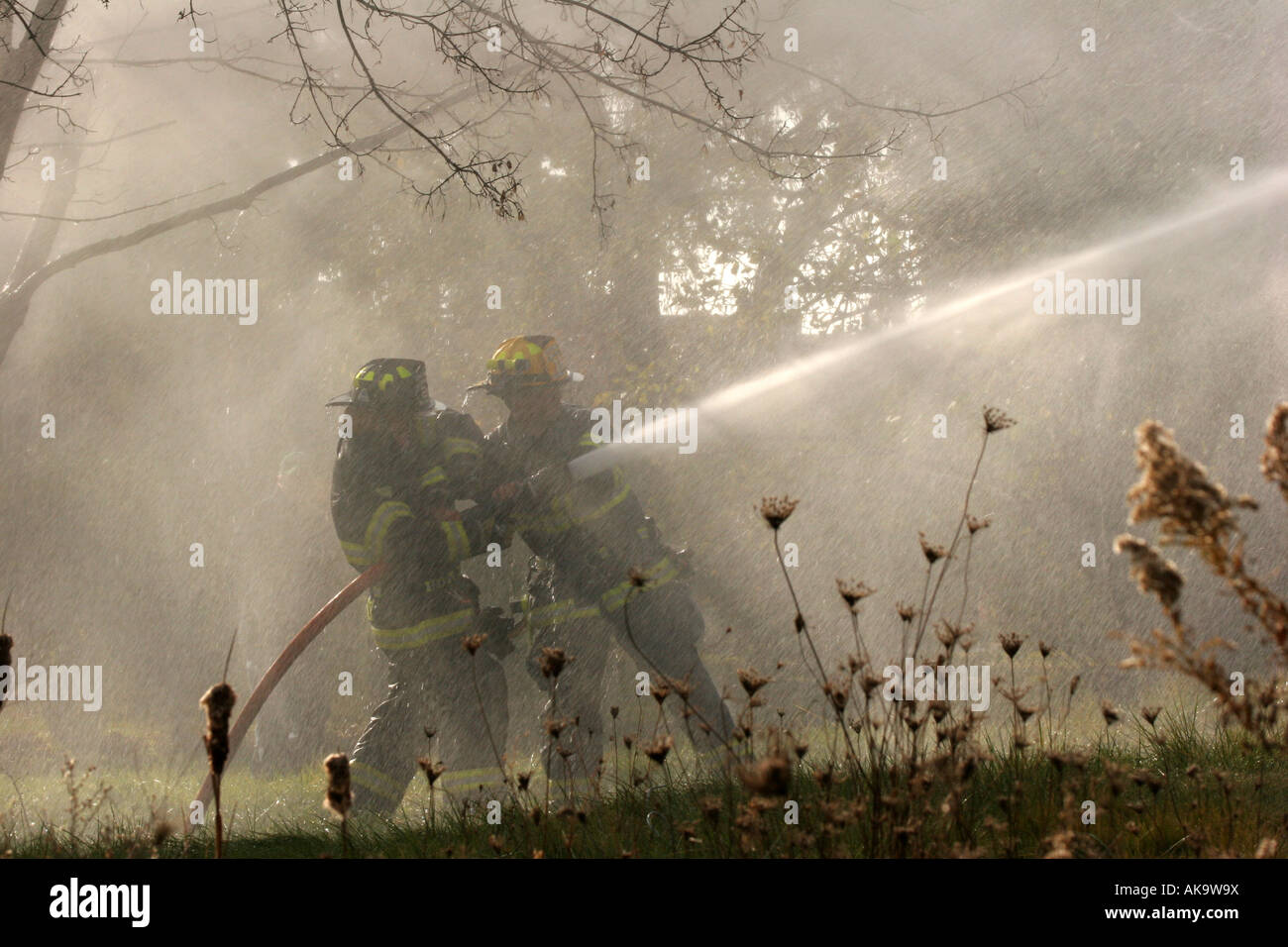 Fire engine spraying water on hi-res stock photography and images - Alamy