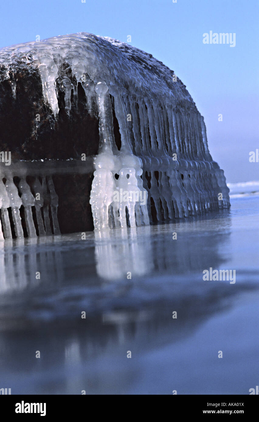 Ice covered boulder at seaside Stock Photo - Alamy