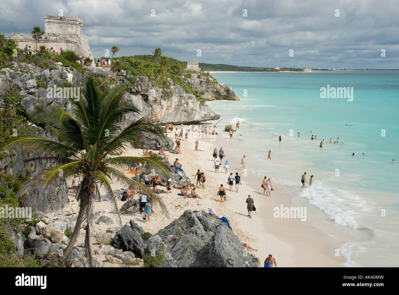 Tulum Ruins on the Cliff Top and People on the White Sandy Beach and ...