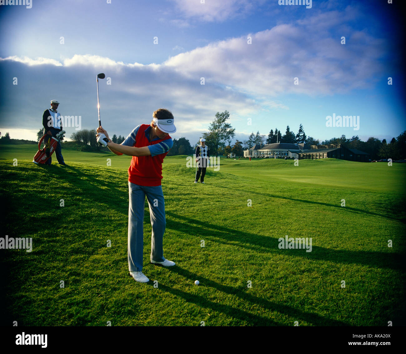 Golfer Hitting Ball Stock Photo - Alamy