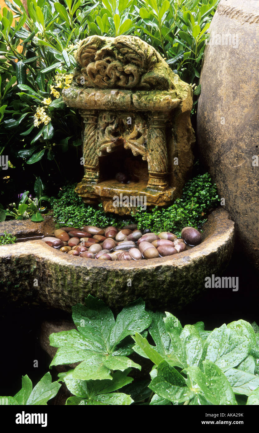 Indian water feature stone sculpture sacred Stock Photo - Alamy