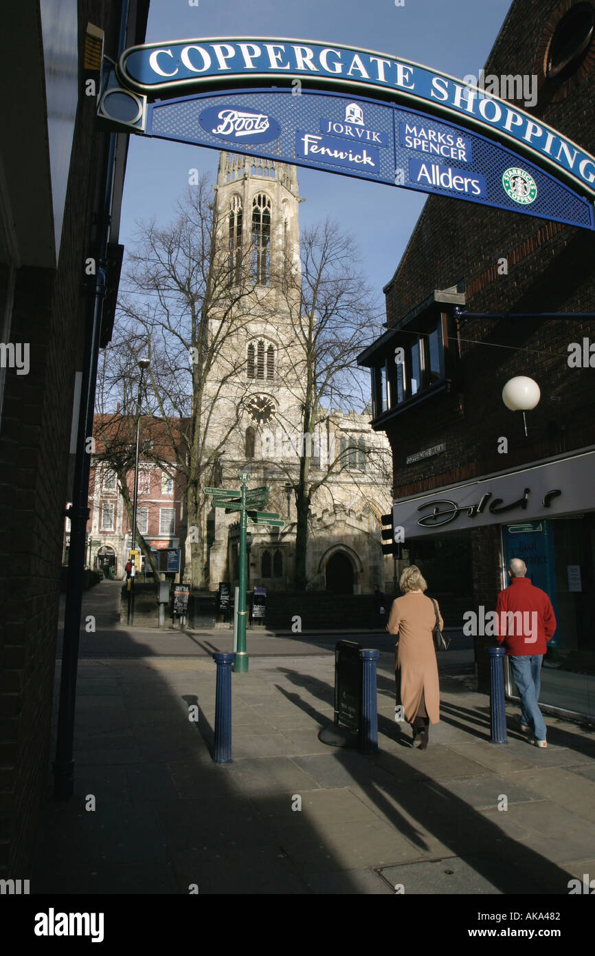 Sign over entrance to Coppergate Shopping mall York with church through ...