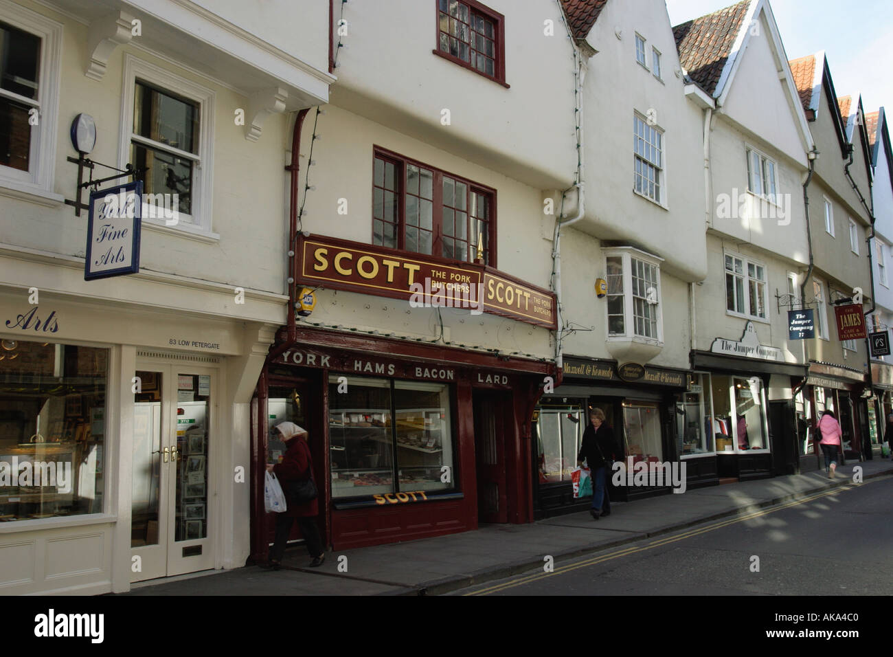 Shop frontages in Lower Petergate York with traditional signage Stock ...