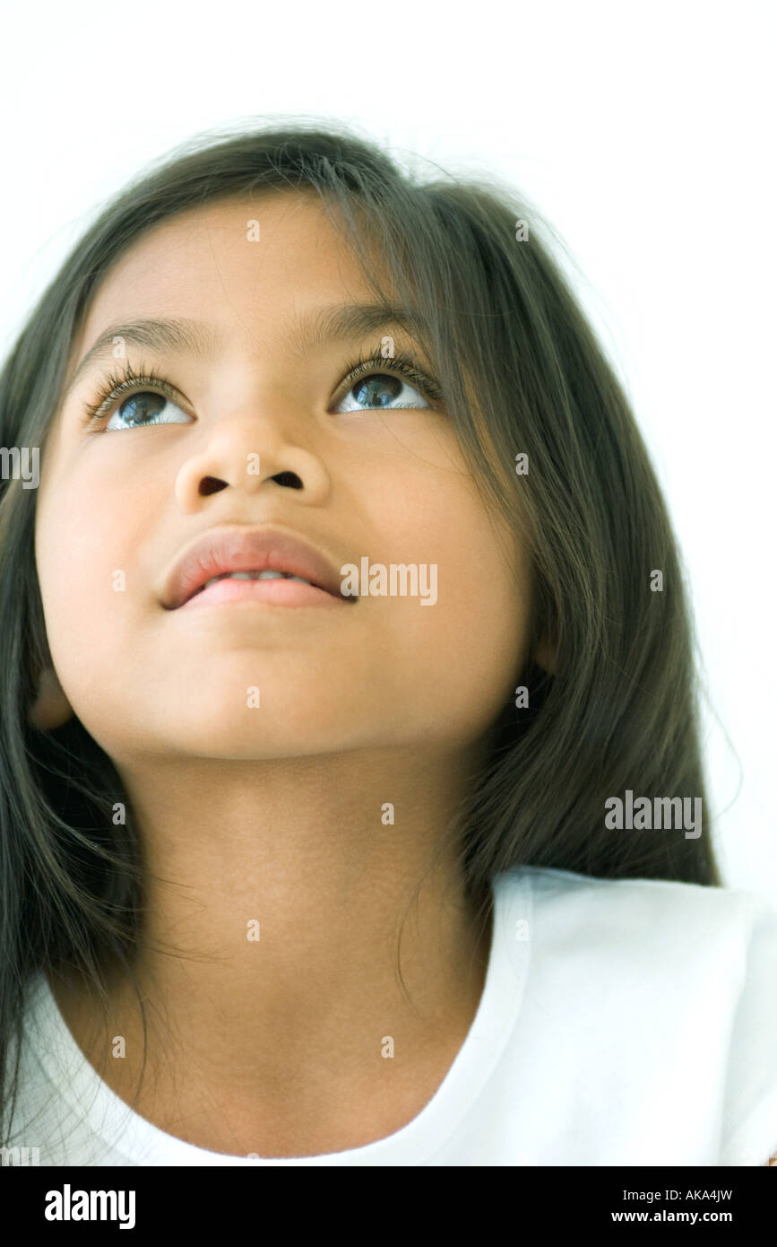 Girl looking up, smiling, portrait Stock Photo - Alamy