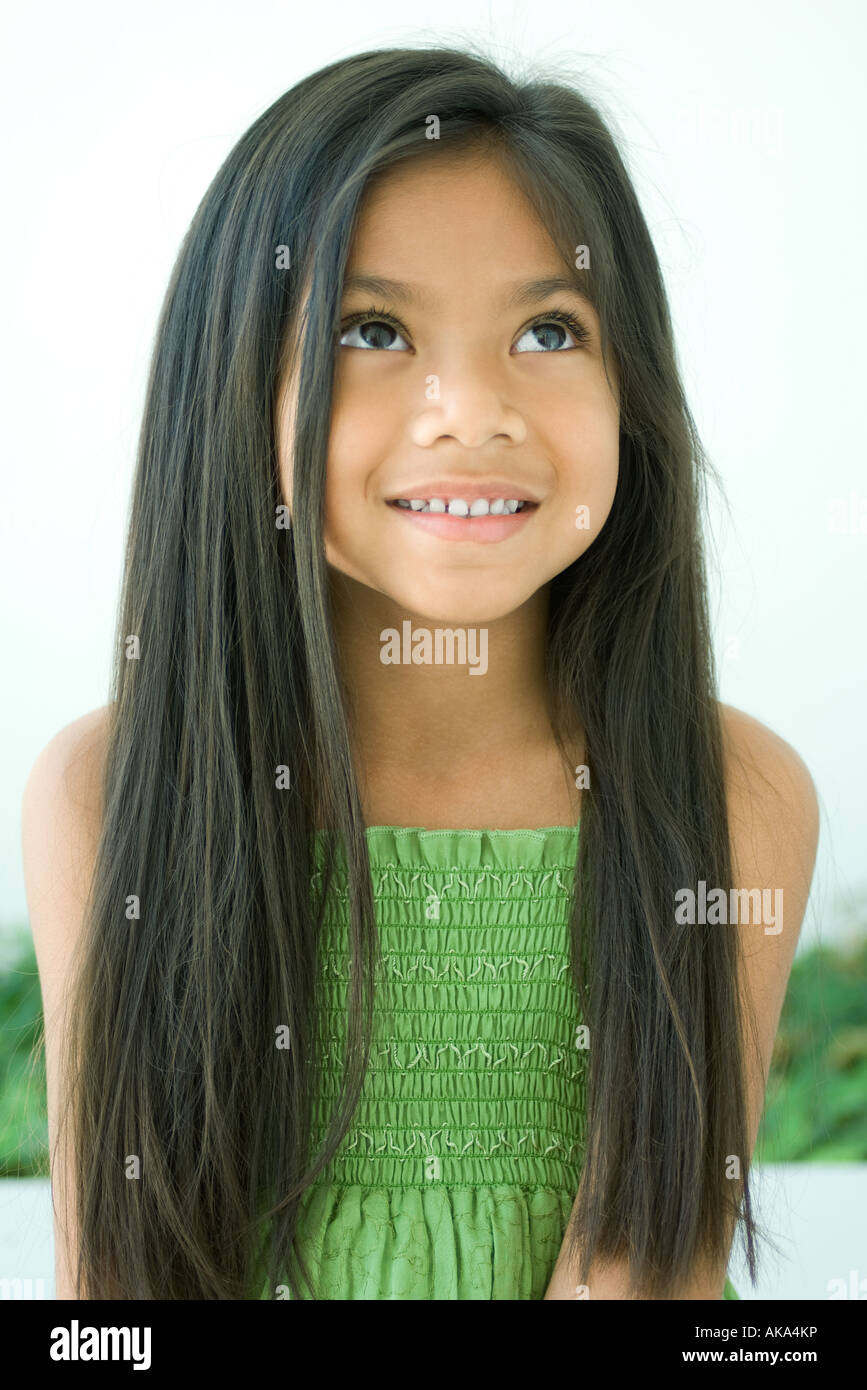 Girl looking up, smiling, portrait Stock Photo - Alamy