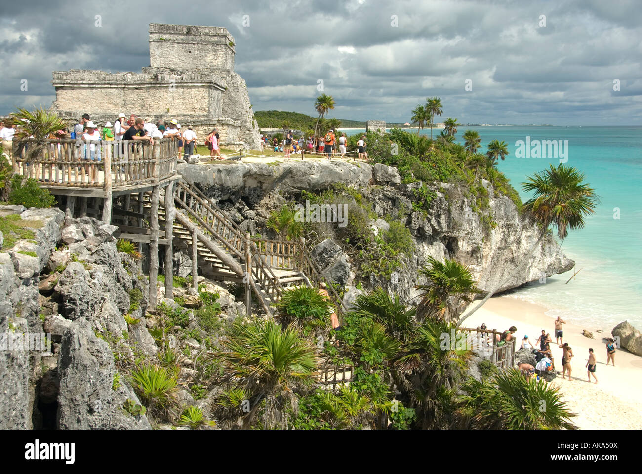 Tulum Ruins on Cliff Top and People Climbing Steps Down to White Sandy ...
