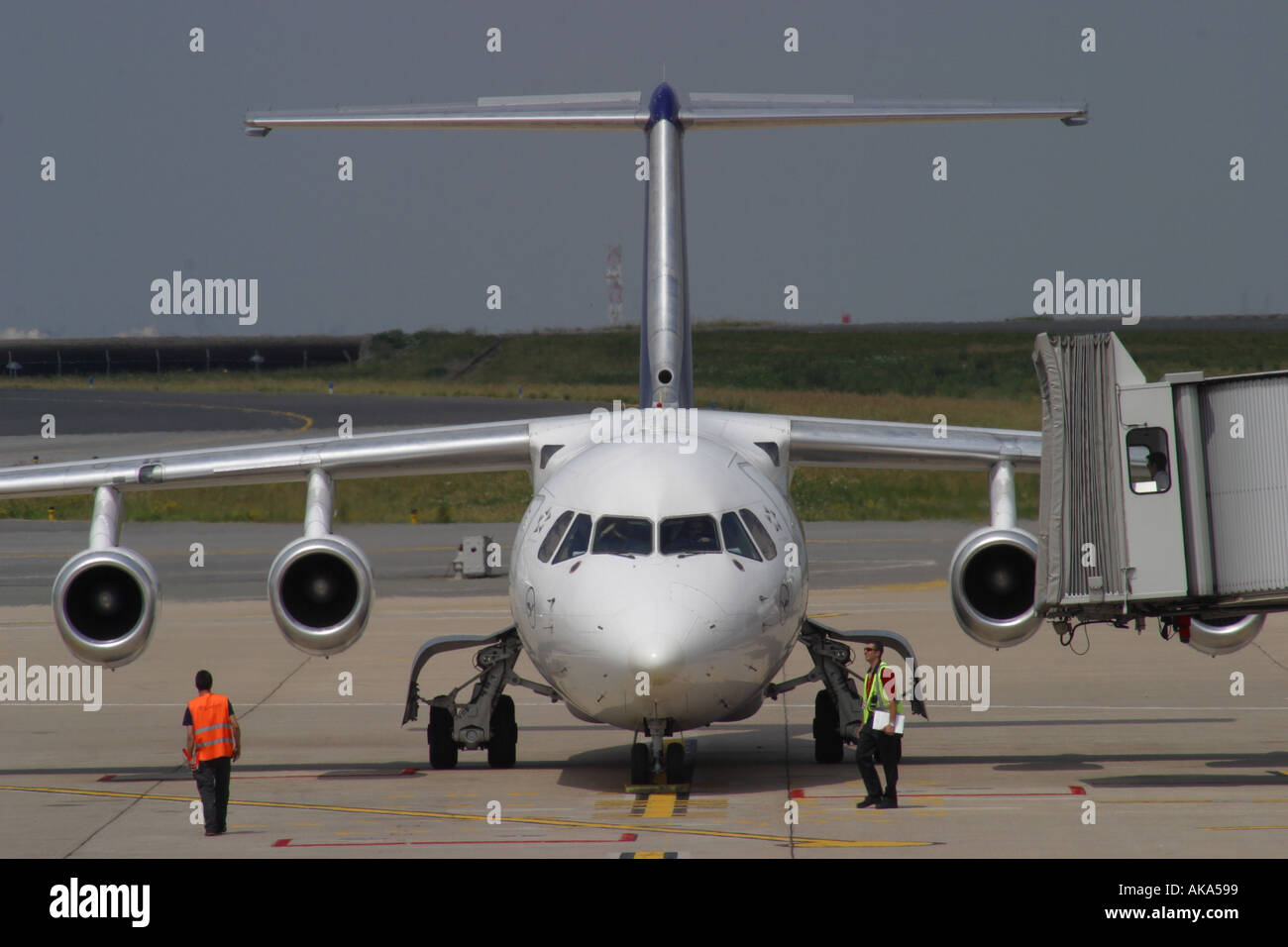 Avro Regional Jet four engined airliner with groundcrew about to depart ...
