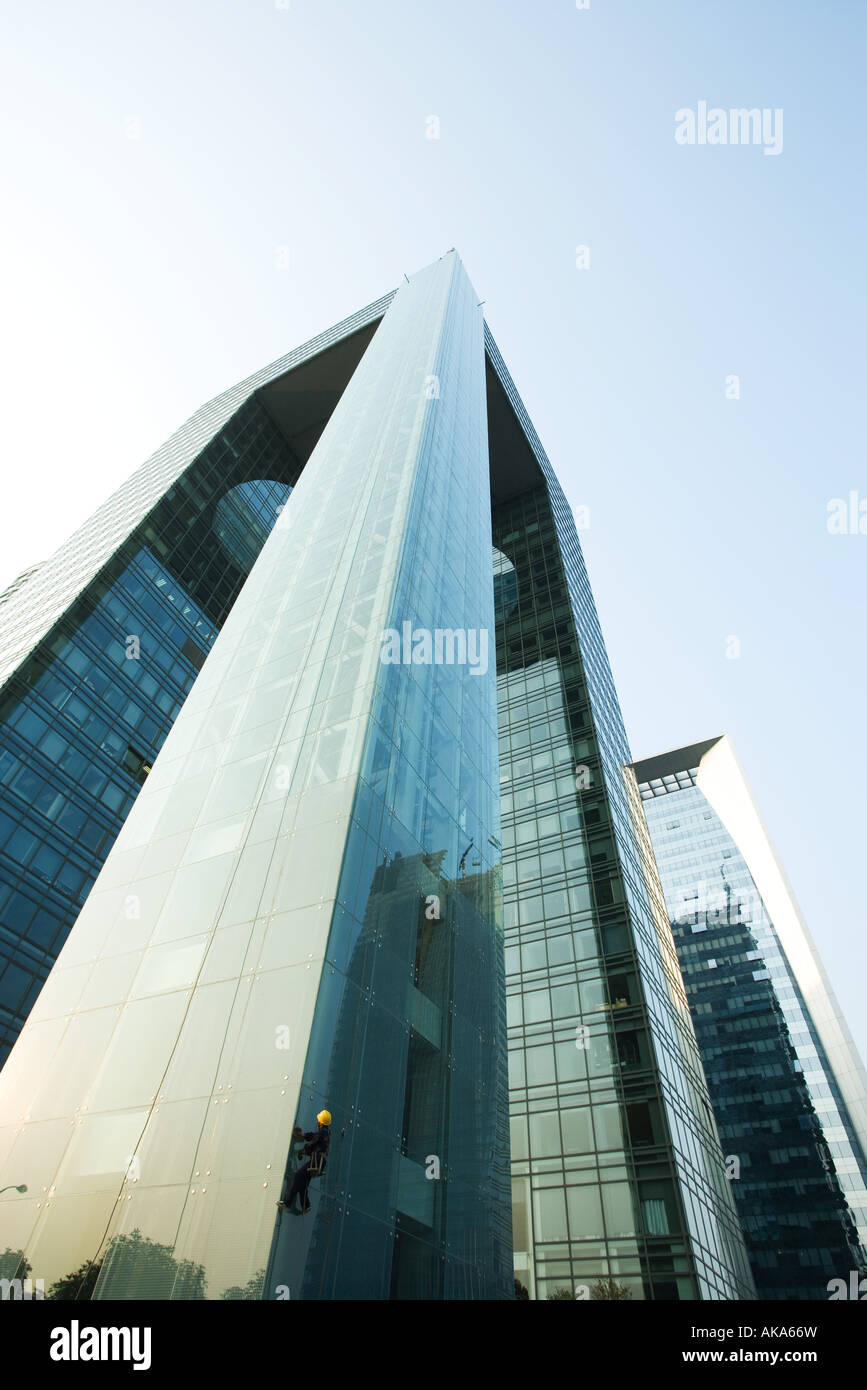 Window washer on corner of skyscraper, low angle view Stock Photo - Alamy