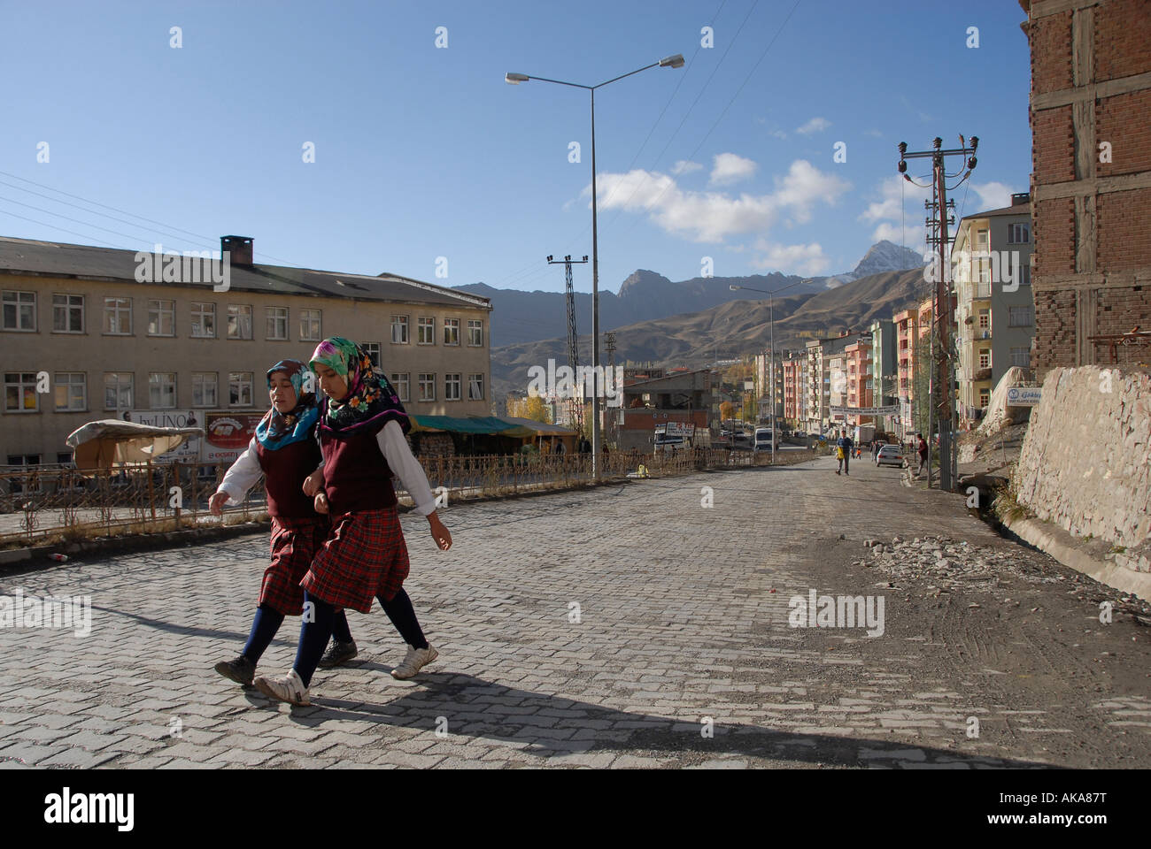 Kurdish girls walk through the town of Hakkari near the Turkish-Iraqi ...