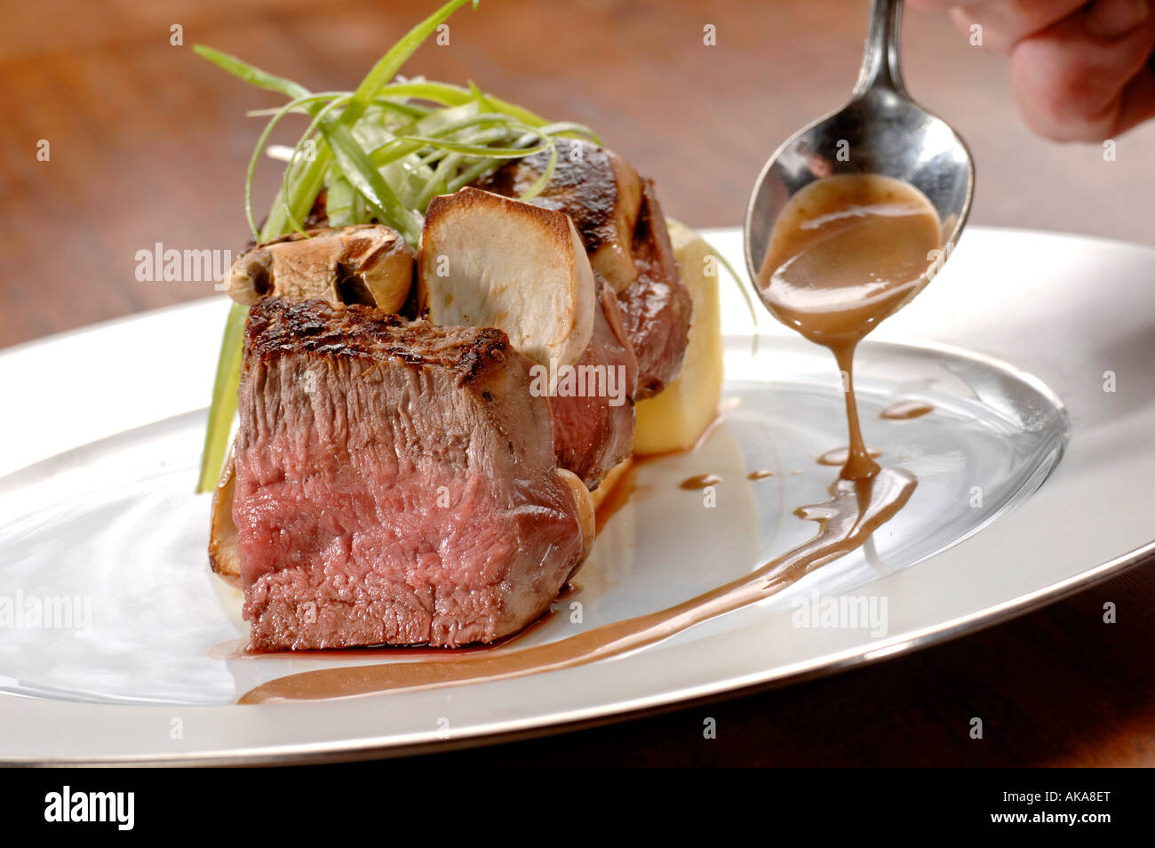 Medium rare fillet steak with mushrooms Stock Photo - Alamy