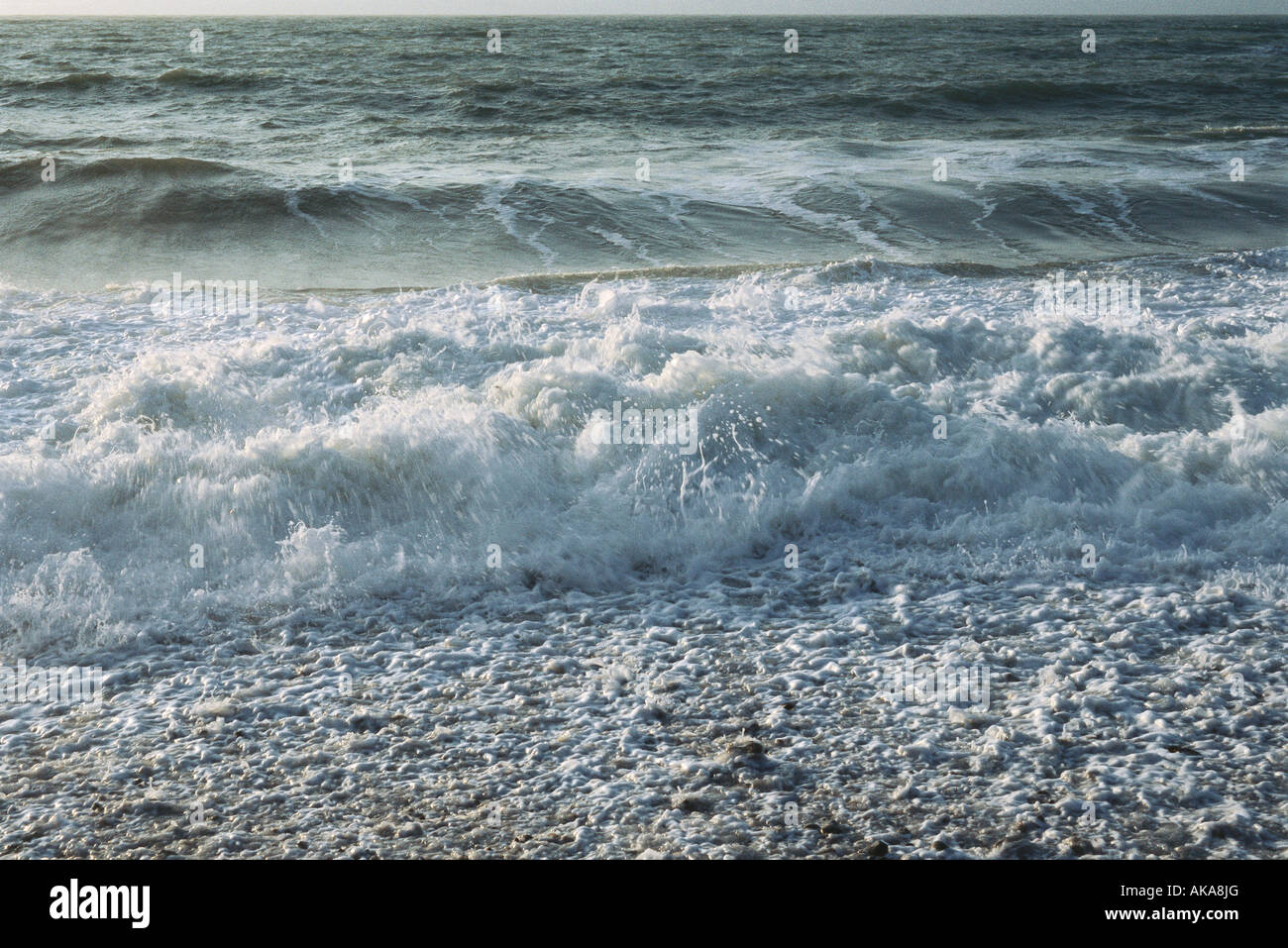 Surf washing over shore Stock Photo - Alamy