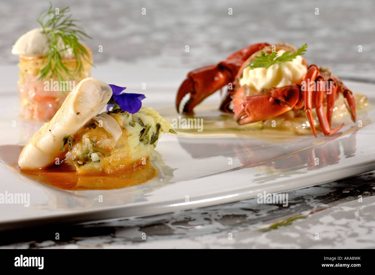Prawn stack fish stuffed canneloni and crab mousse Stock Photo - Alamy