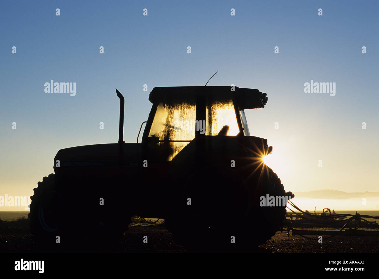 Sunrise modern tractor Stock Photo - Alamy